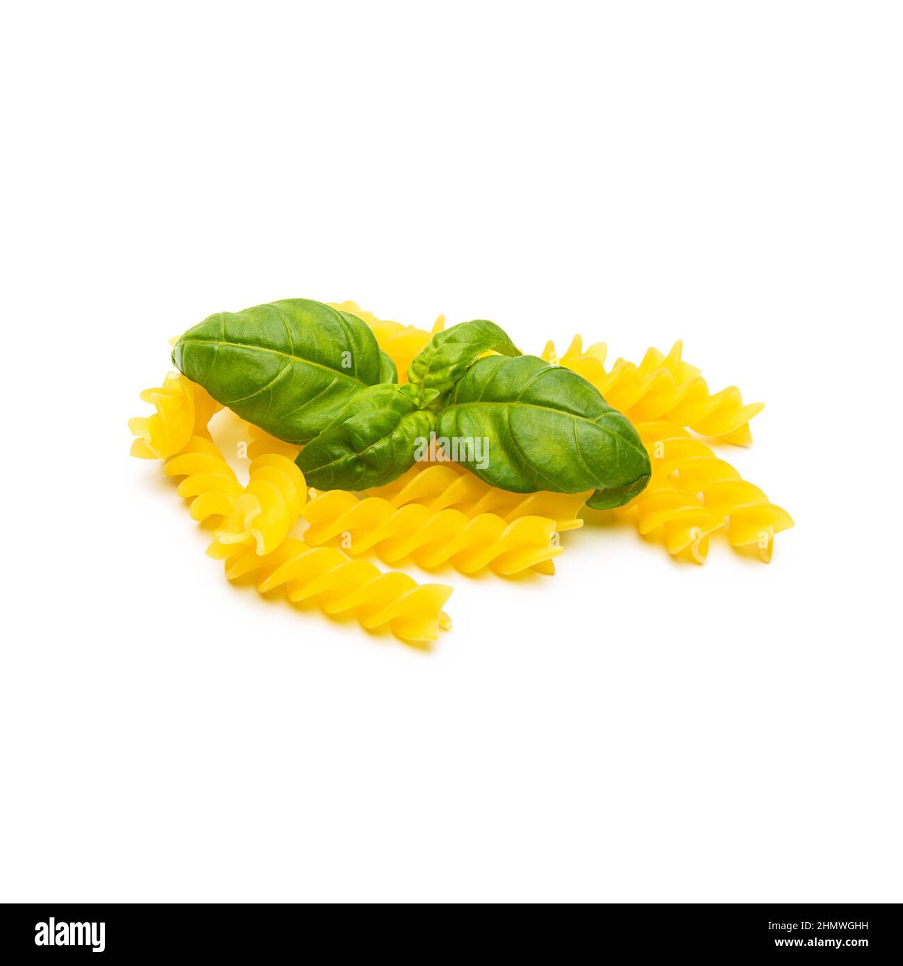 fusilli spiral pasta with basil leaf Stock Photo - Alamy