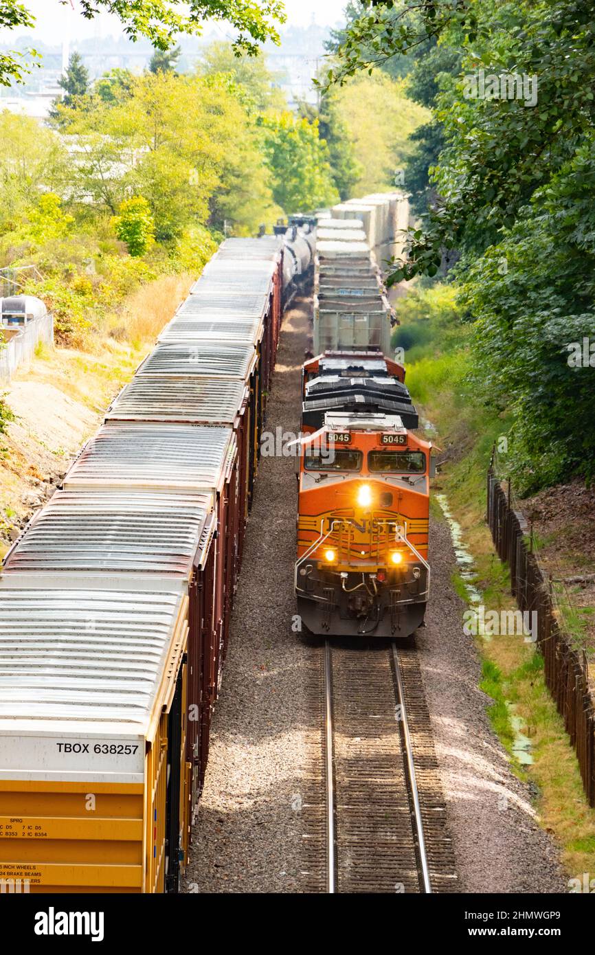 orange BNSF American freight trains from bridge above railway tracks ...