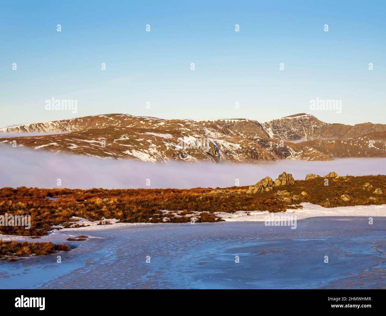 The Helvellyn mountain range with Striding Edge, poking out of the ...
