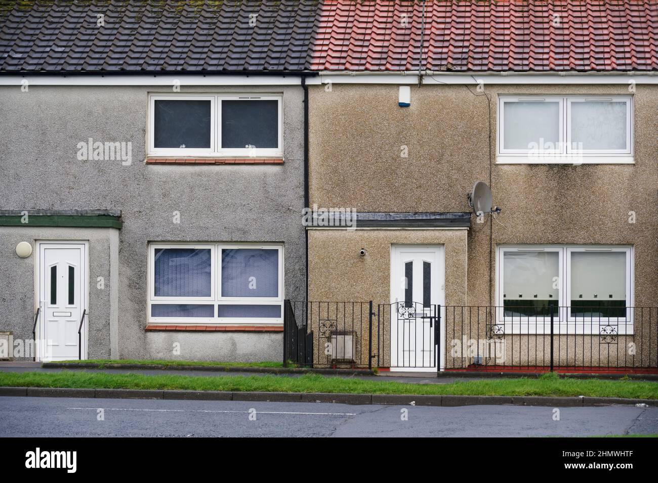 Derelict council house in poor housing estate slum with many social ...