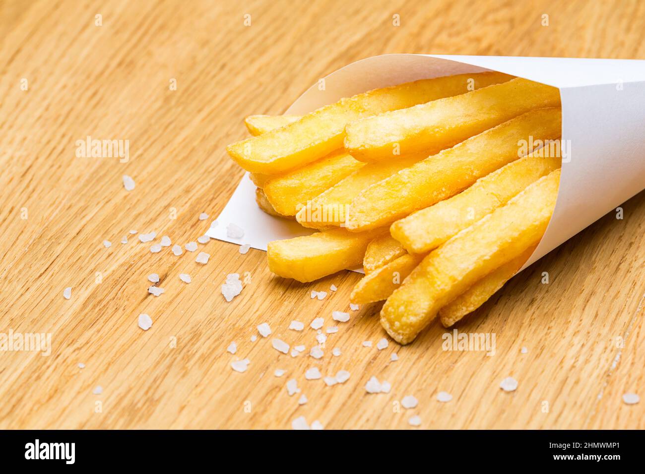 salted french fries in a bag Stock Photo - Alamy