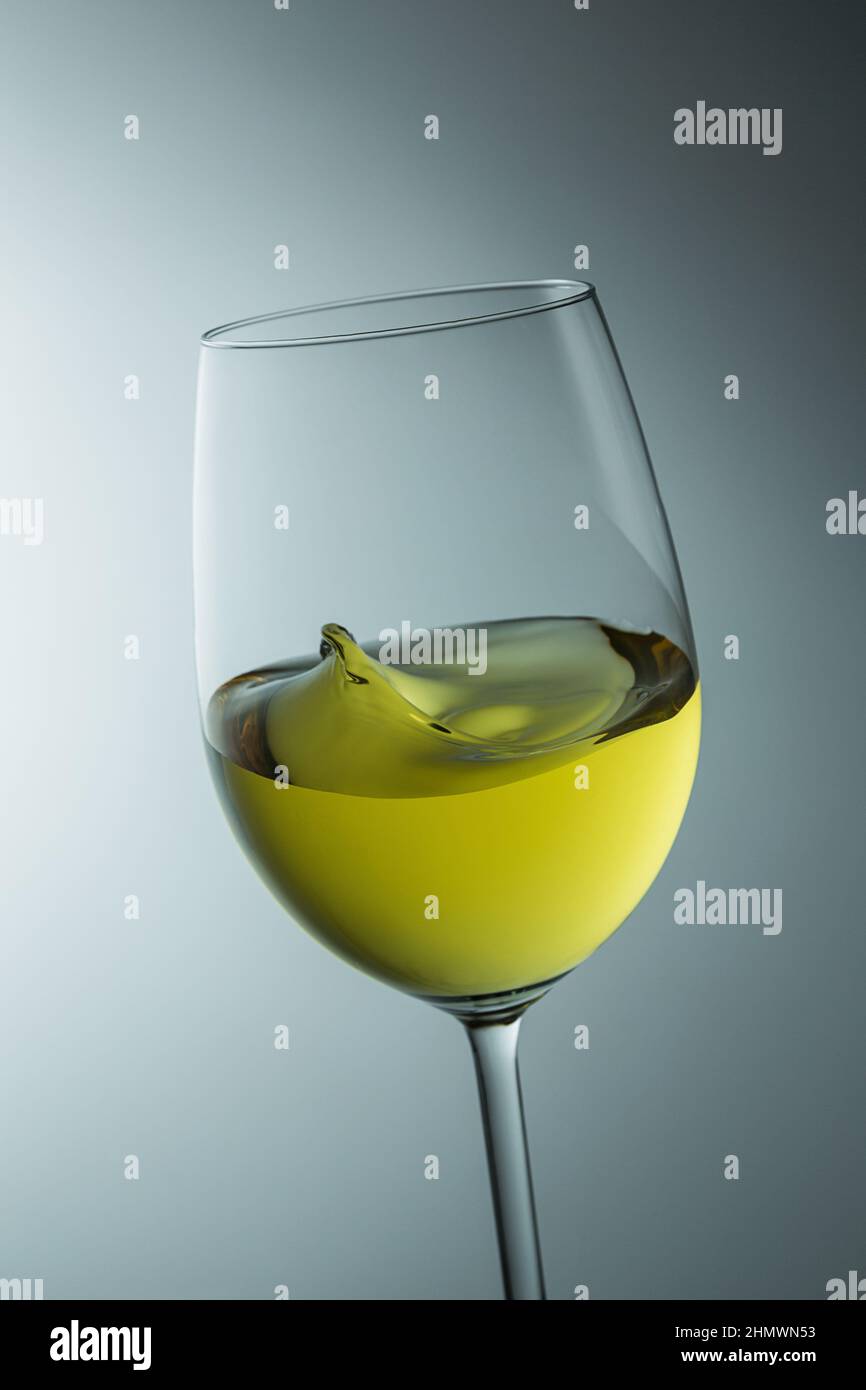 White wine glass with wave Stock Photo - Alamy