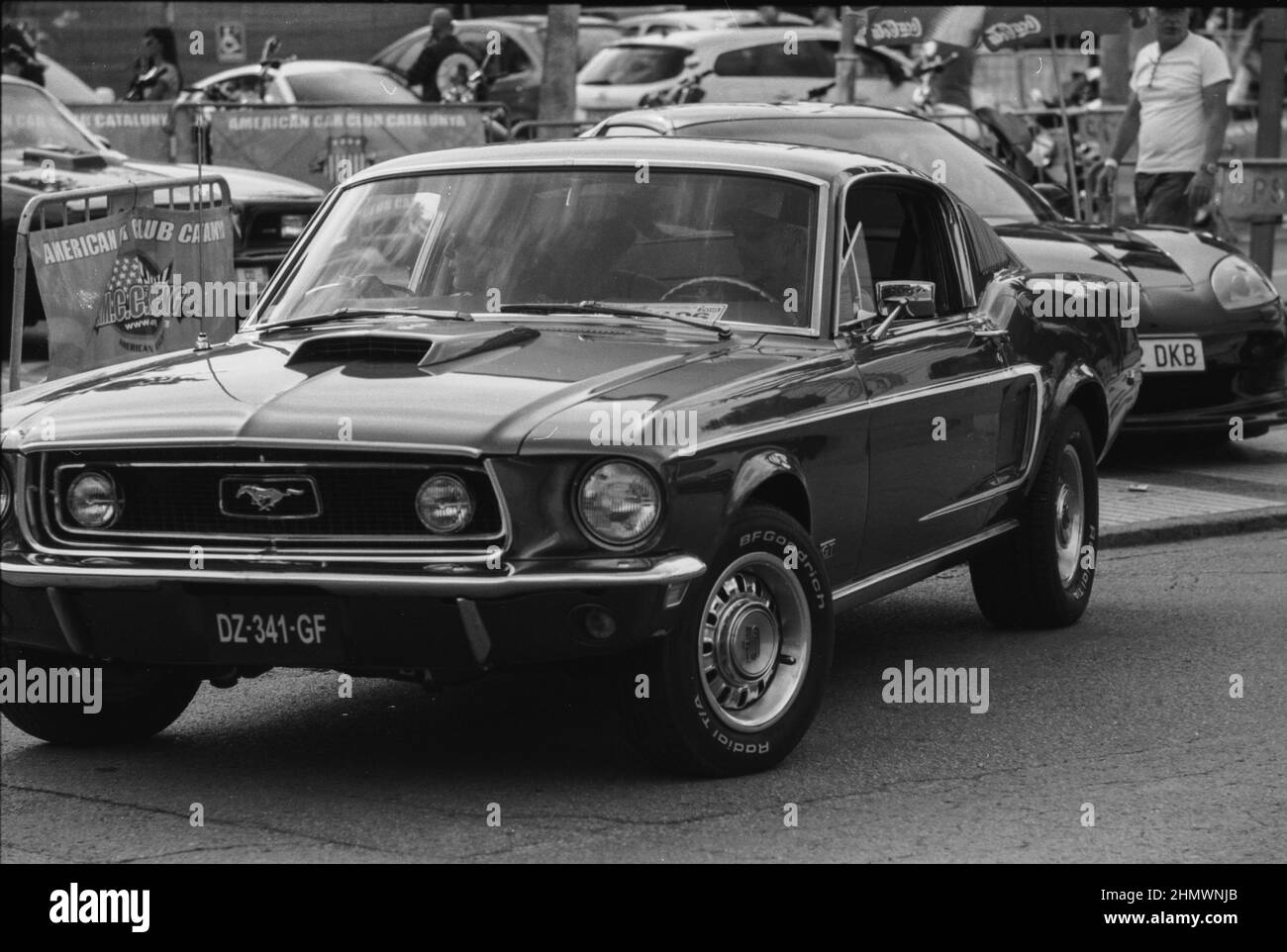 Grayscale shot of an old classic Ford Mustang car in a street Stock ...