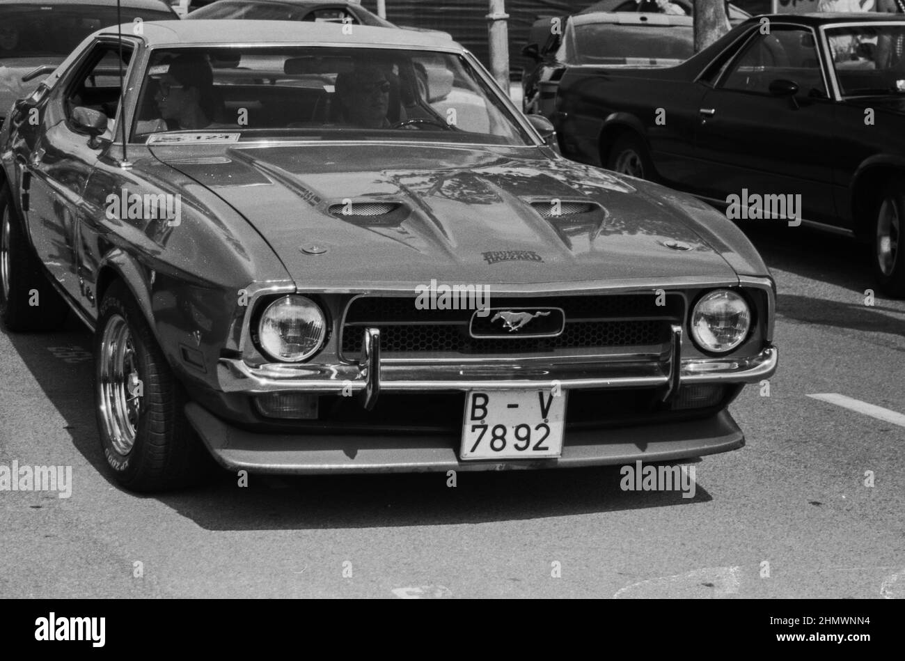 Grayscale shot of an old classic Ford Mustang car in a street Stock ...