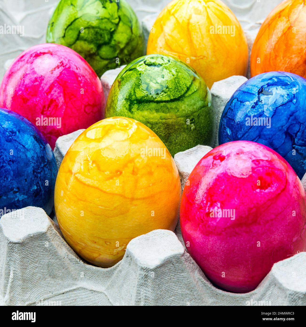 colorful easter eggs in a egg carton Stock Photo - Alamy