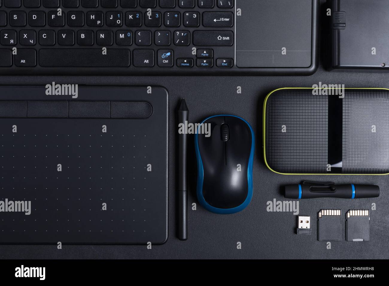 Top view of designer work place with graphics tablet, memory card ...