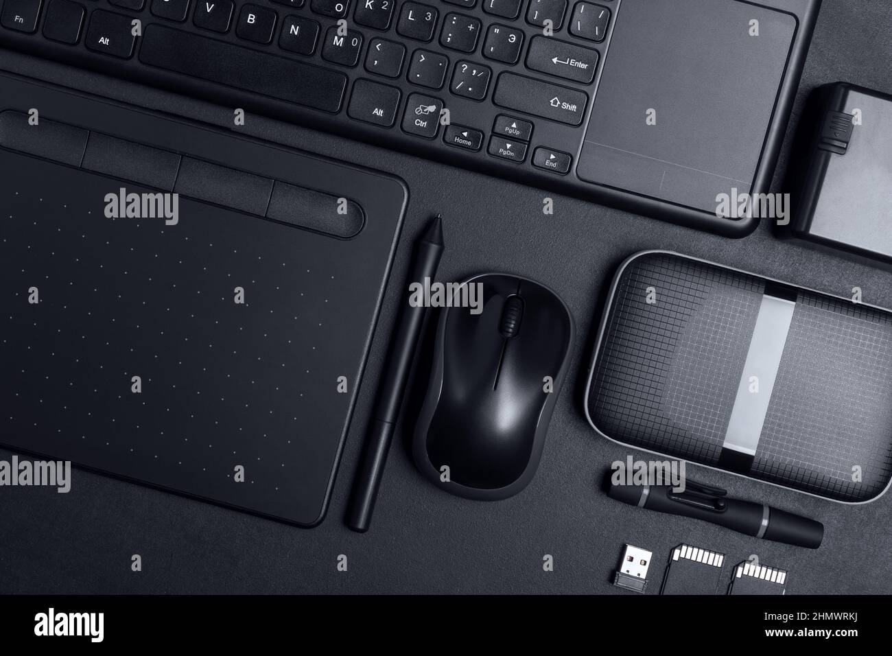 Top view of designer work place with graphics tablet, memory card ...