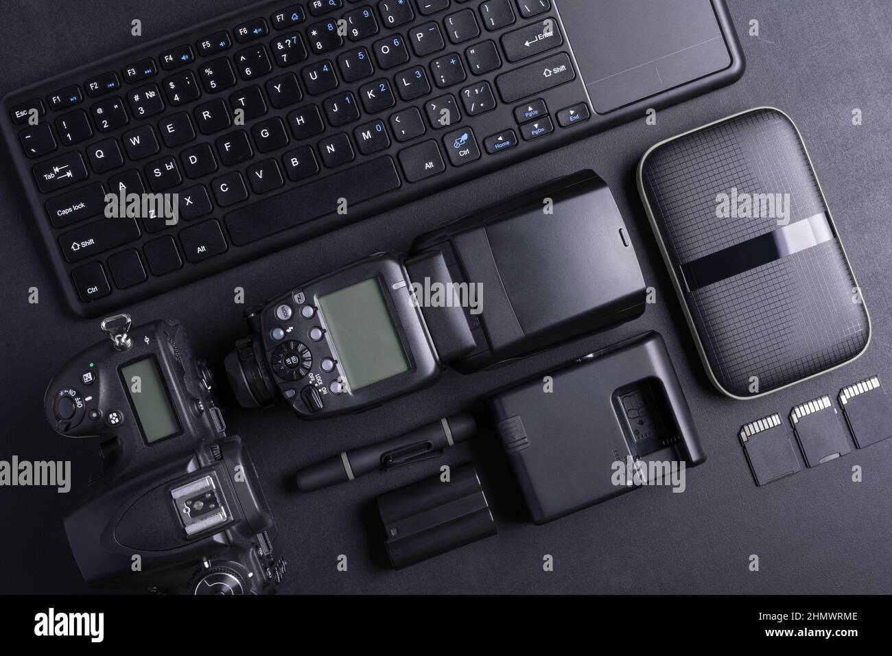 Top view of photographer work space with digital camera, flash, memory ...