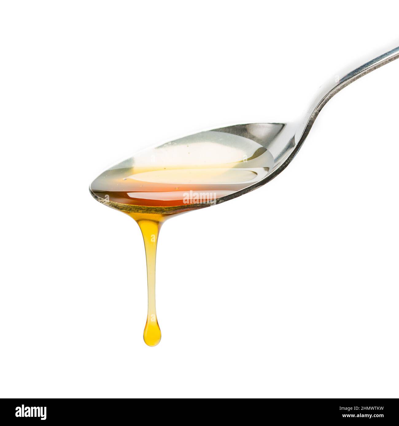 spoon with honey drop Stock Photo - Alamy