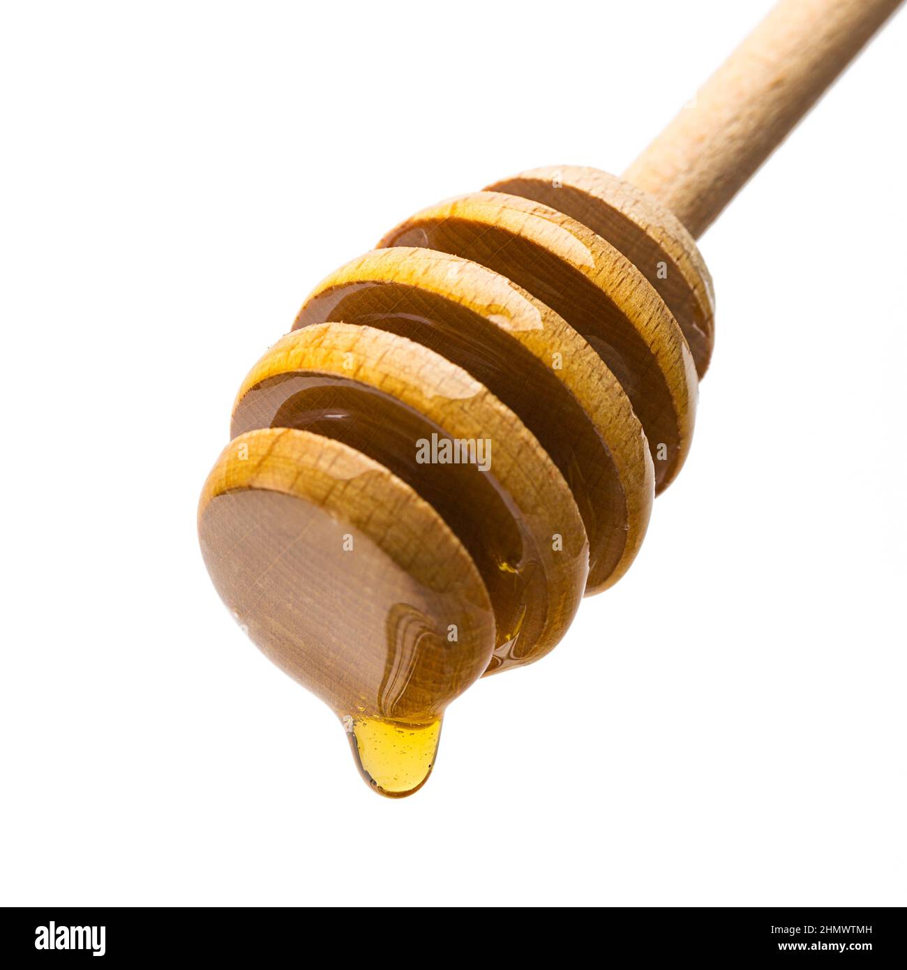 drop of honey on a honey dipper Stock Photo - Alamy