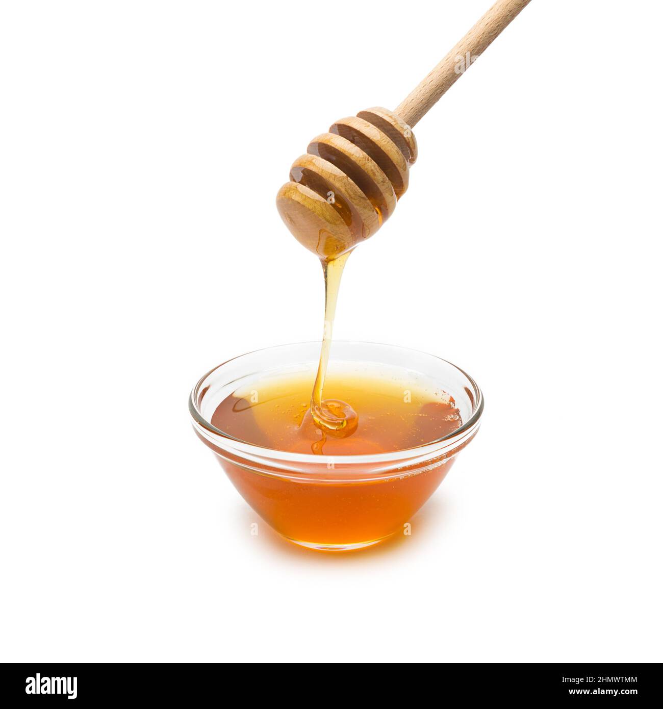 shell with honey and honey dipper Stock Photo - Alamy