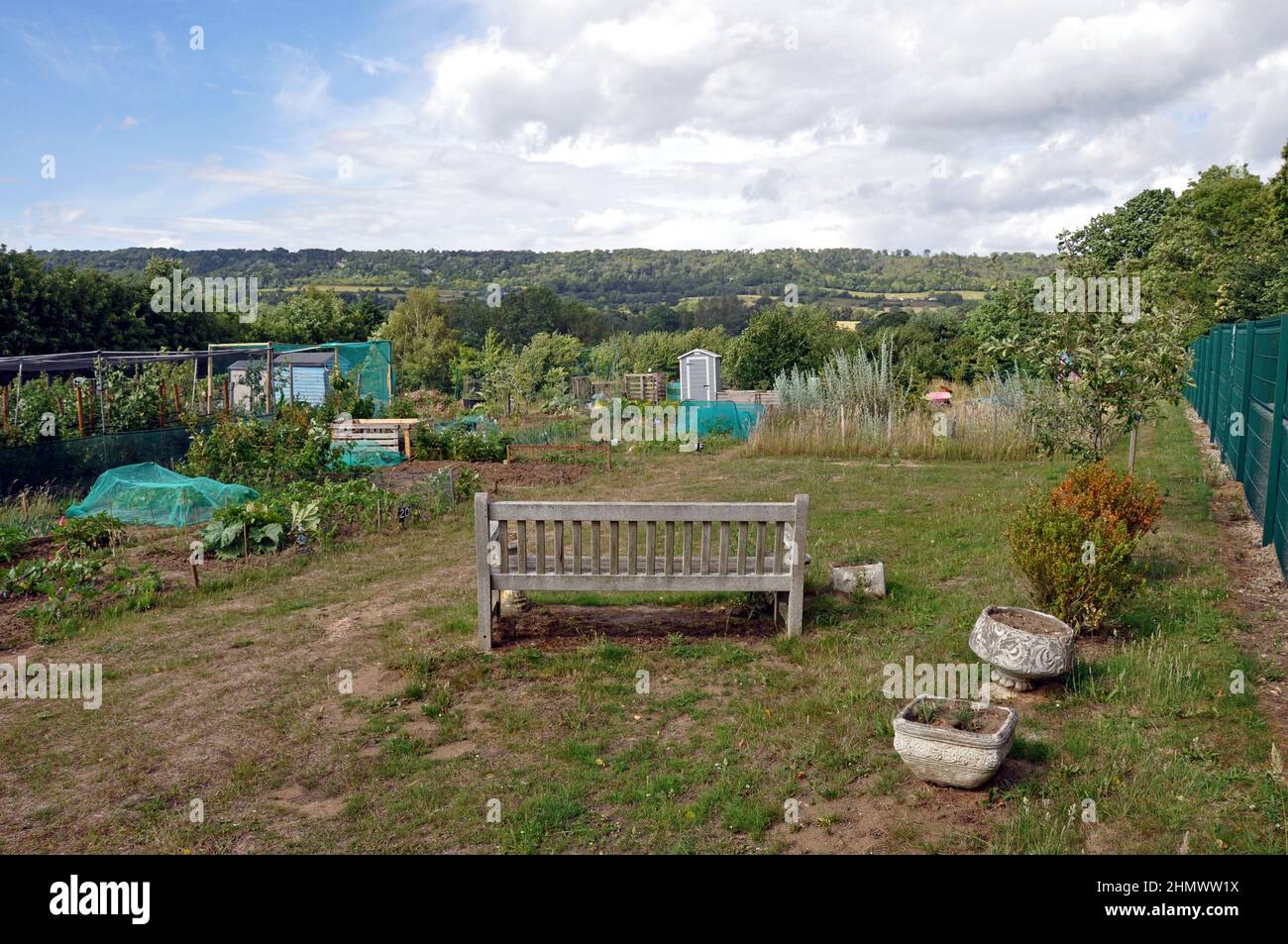 Traditional English Allotment with sheds and plots with trees and view ...