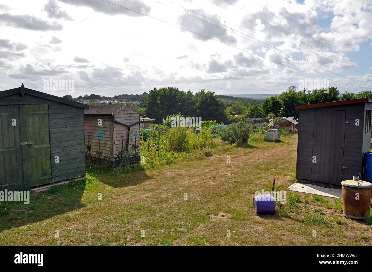 Traditional English Allotment with sheds and plots with trees and view ...