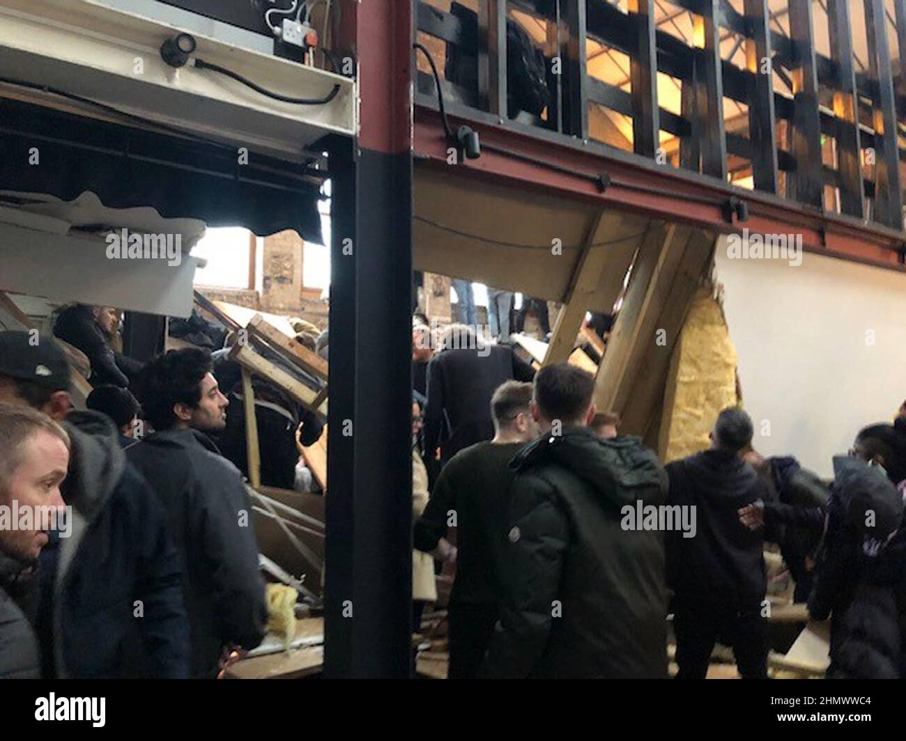 BEST QUALITY AVAILABLE Staff and patrons inside the Two More Years bar ...