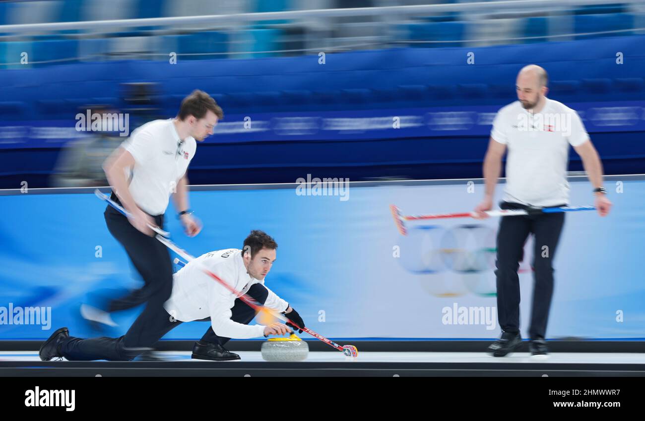 Beijing, China. 12th Feb, 2022. Steffen Walstad (C) of Norway curls the ...