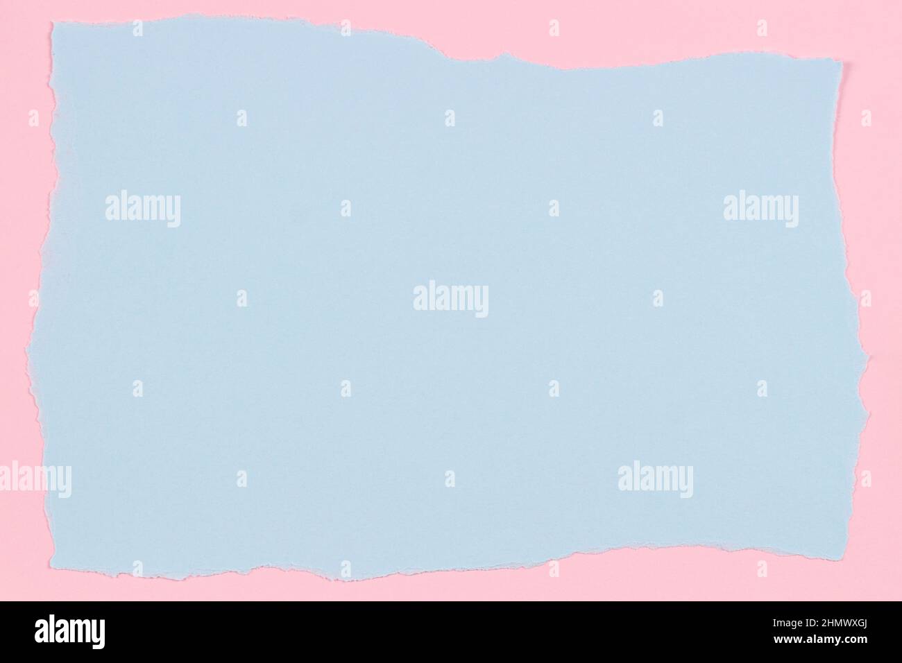 Grunge ripped light blue color paper page with ragged edge on pastel ...