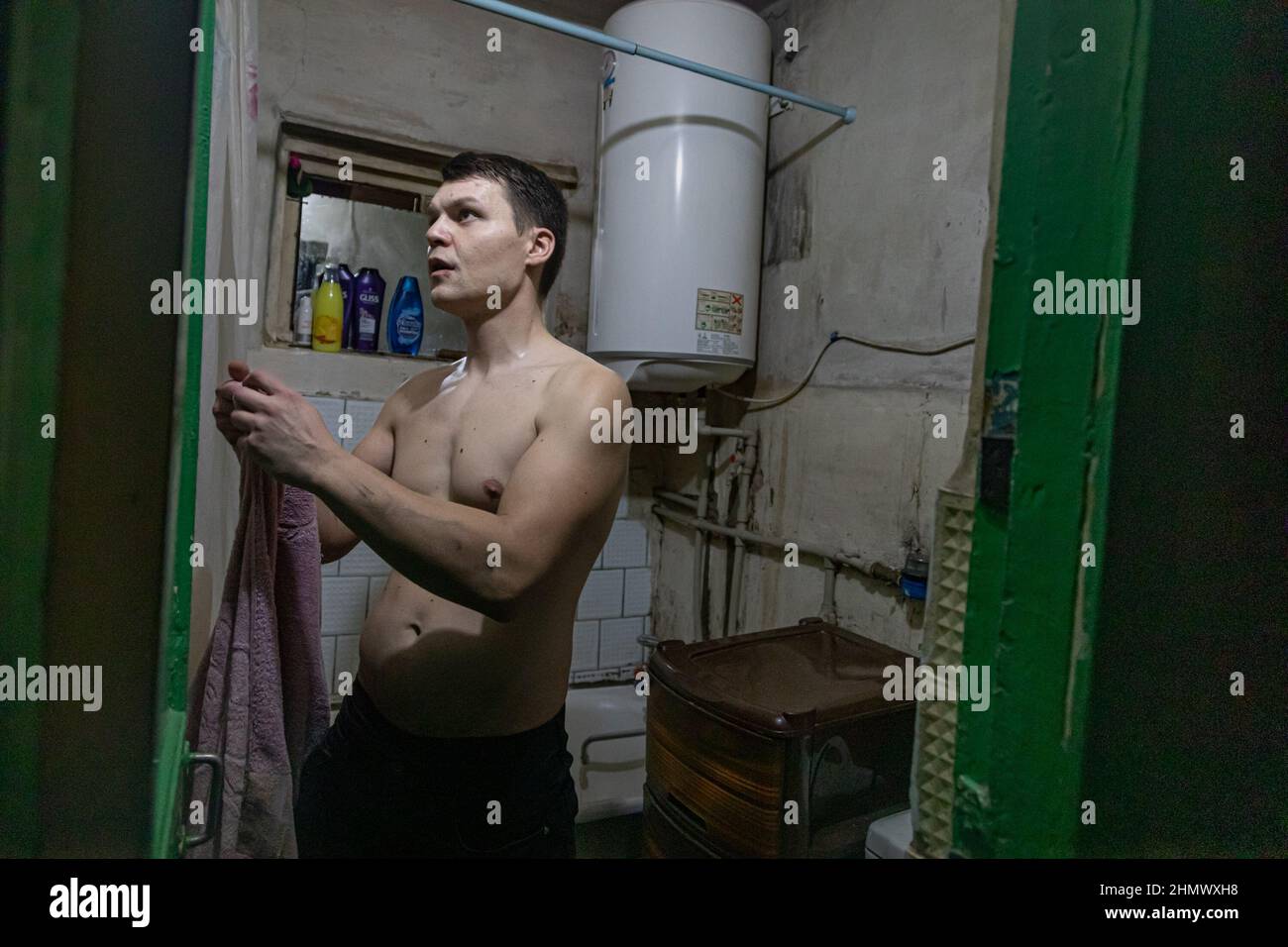 Gornyak, Ukraine. 09th Feb, 2022. Igor Mazur hangs a toweel in the ...