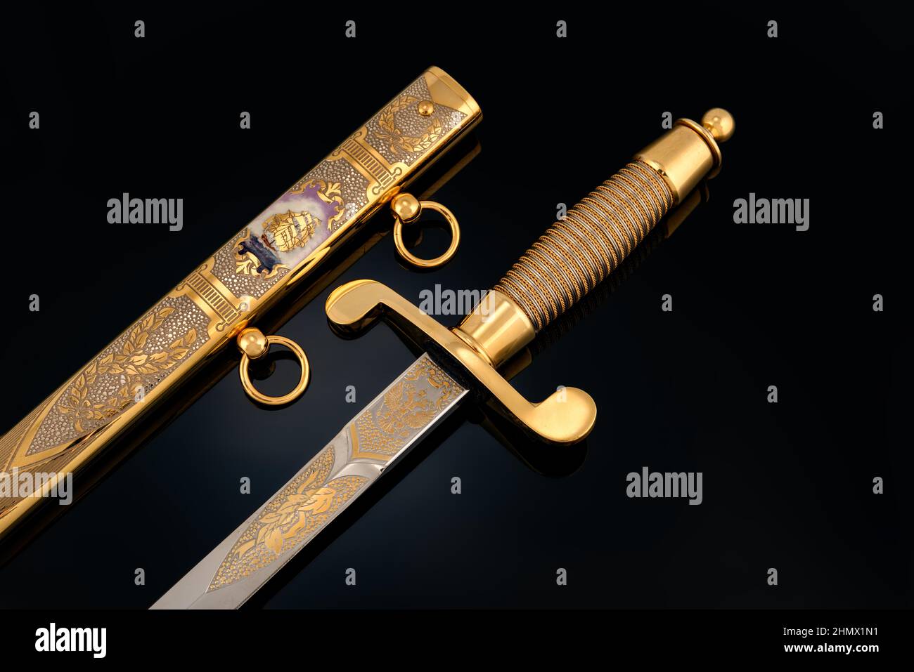 souvenir collectible silver gold dagger with scabbard on black. Luxury ...