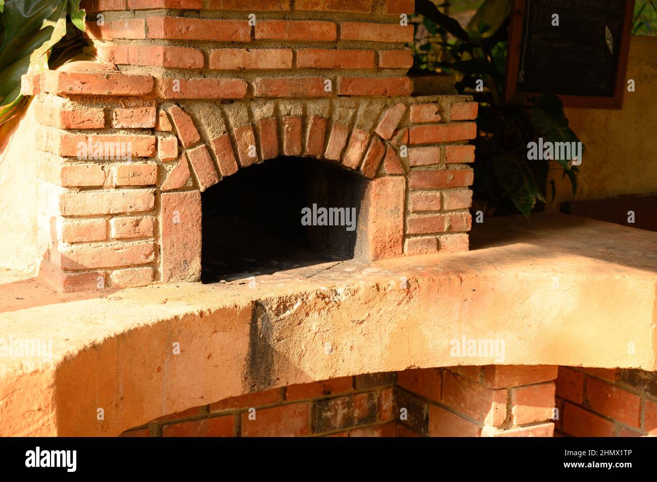 A photo of a brick brazier was taken in a country house. The photo ...