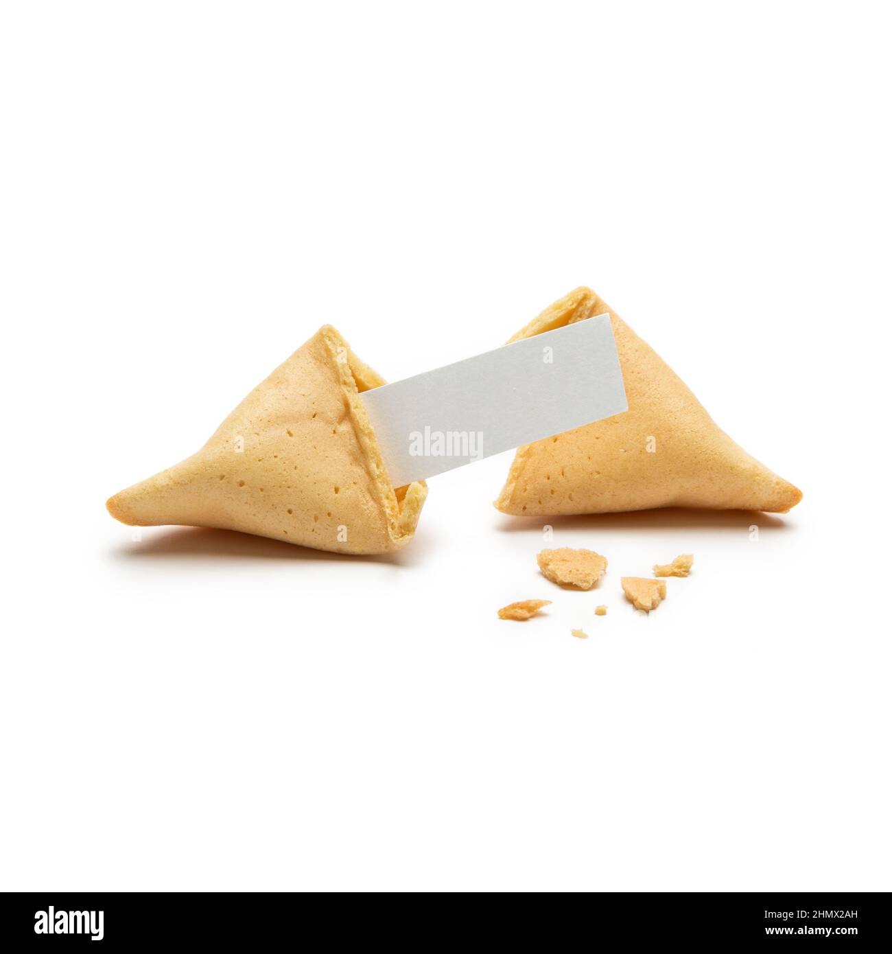 cracked fortune cookie with note and crumbs Stock Photo - Alamy