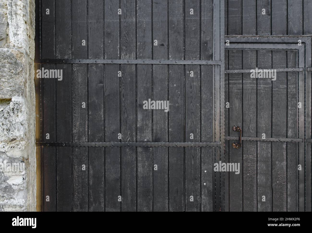 Black and old wooden door texture with iron stripes Stock Photo - Alamy