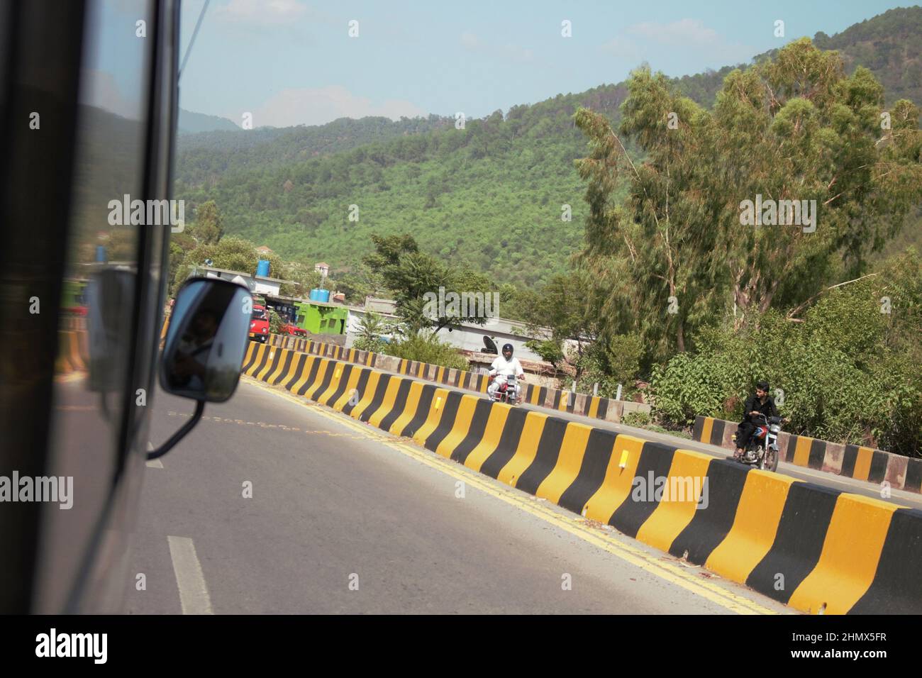 Beautiful view of a road seen from a bus Stock Photo - Alamy