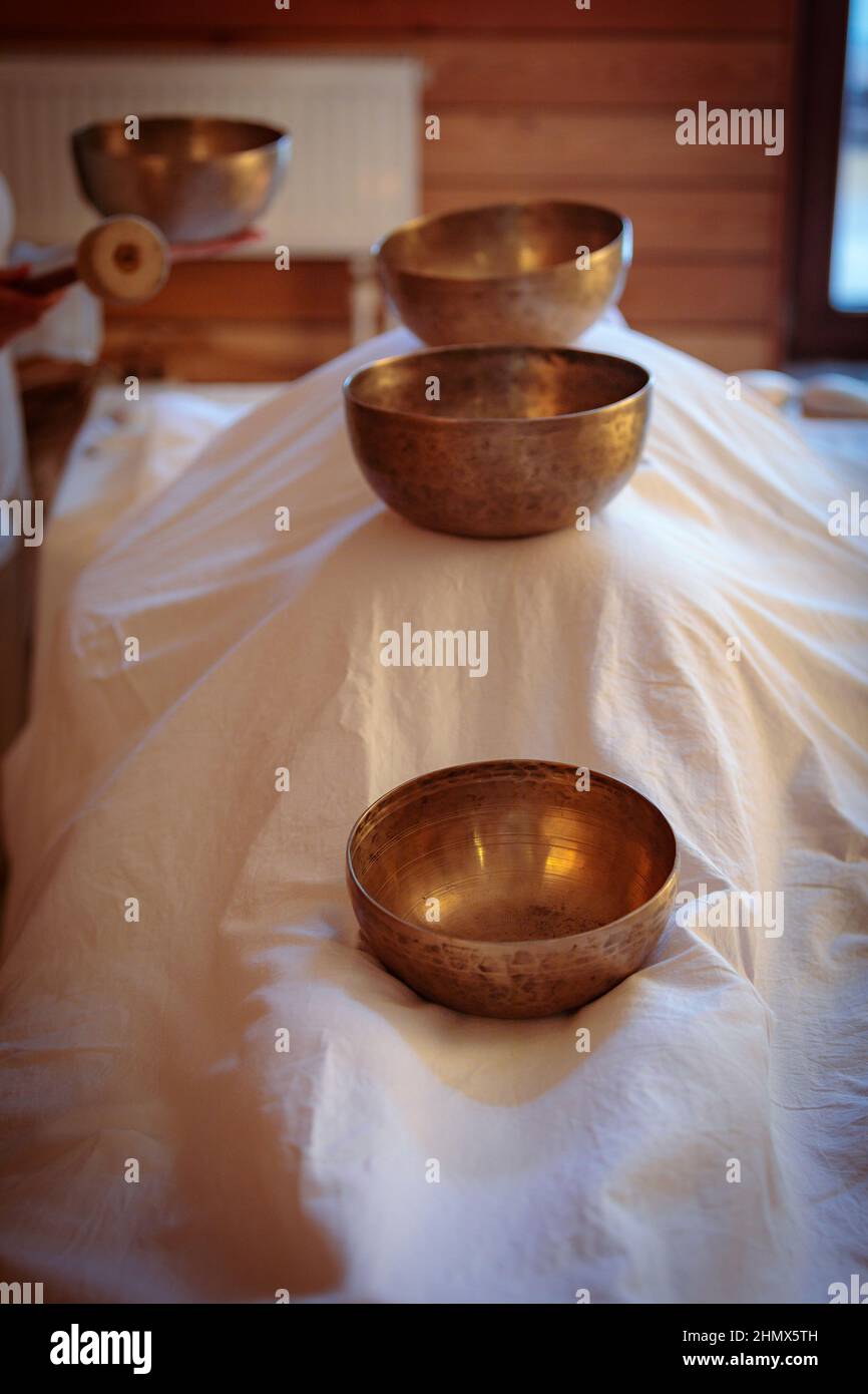 Men perform Tibetan rituals with sound bowls Stock Photo - Alamy