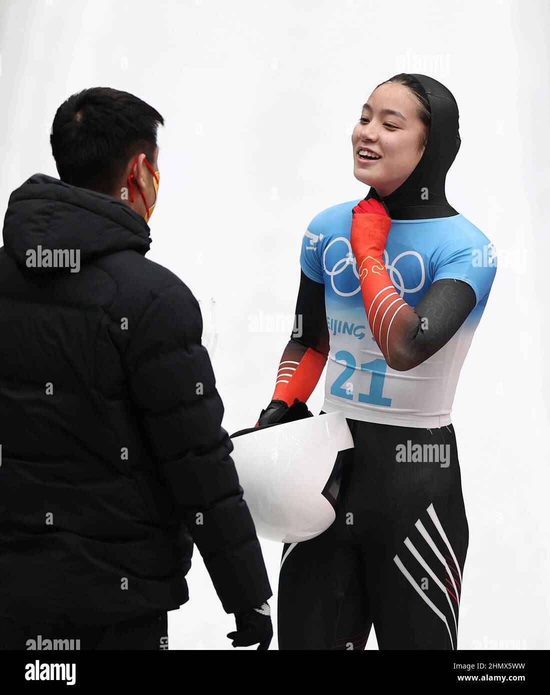 Beijing, China. 12th Feb, 2022. Li Yuxi (R) of China reacts after the skeleton women heat of ...