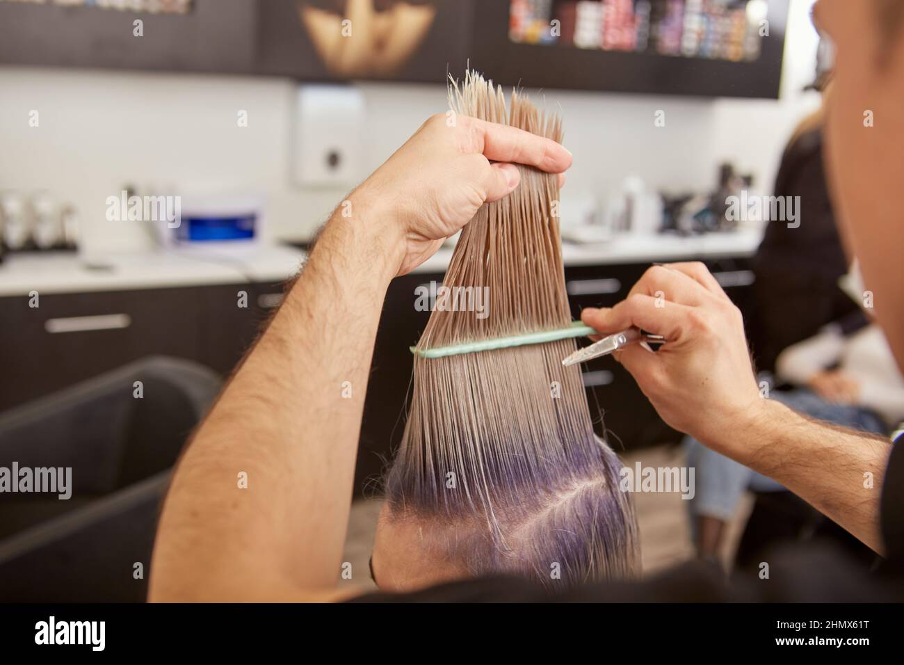 Young woman getting haircut in beauty salon Stock Photo - Alamy