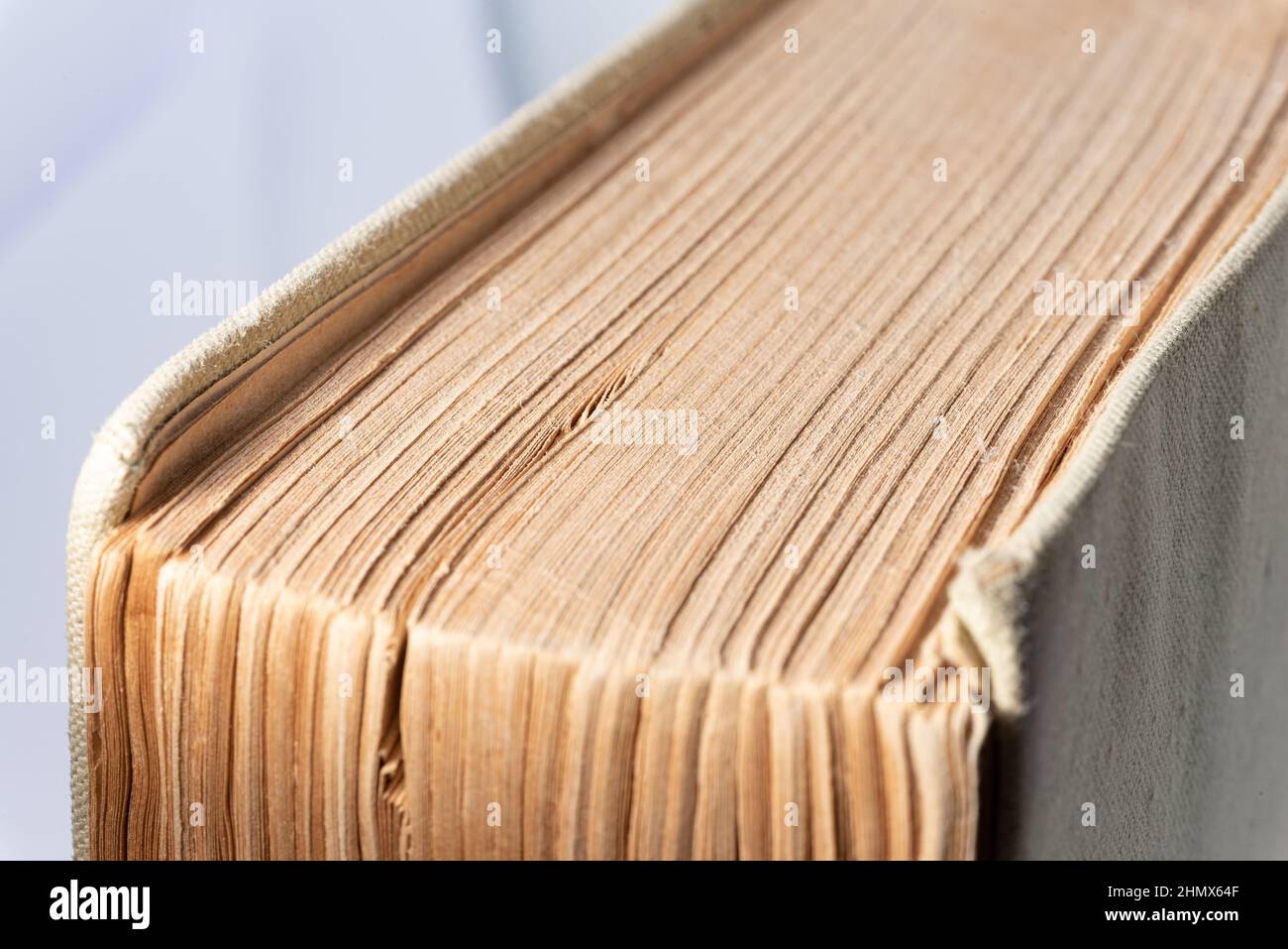 Old book with yellowed pages and a cloth cover. Thick book isolated on ...