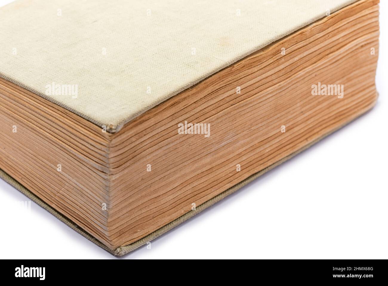 Old book with yellowed pages and a cloth cover. Thick book isolated on ...