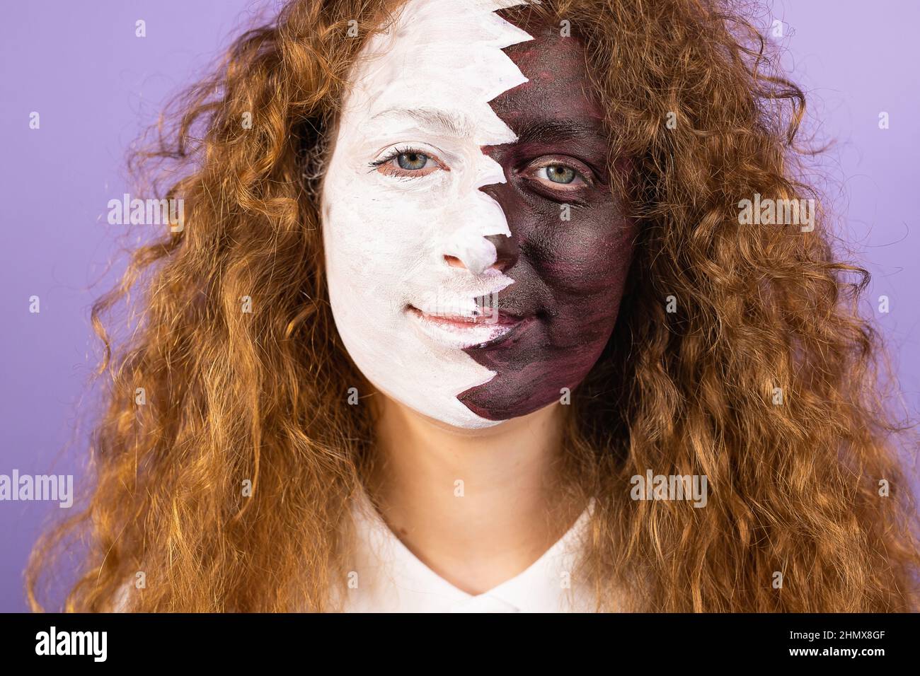 Beautiful fan football red hair curly woman with painted face in Qatar ...
