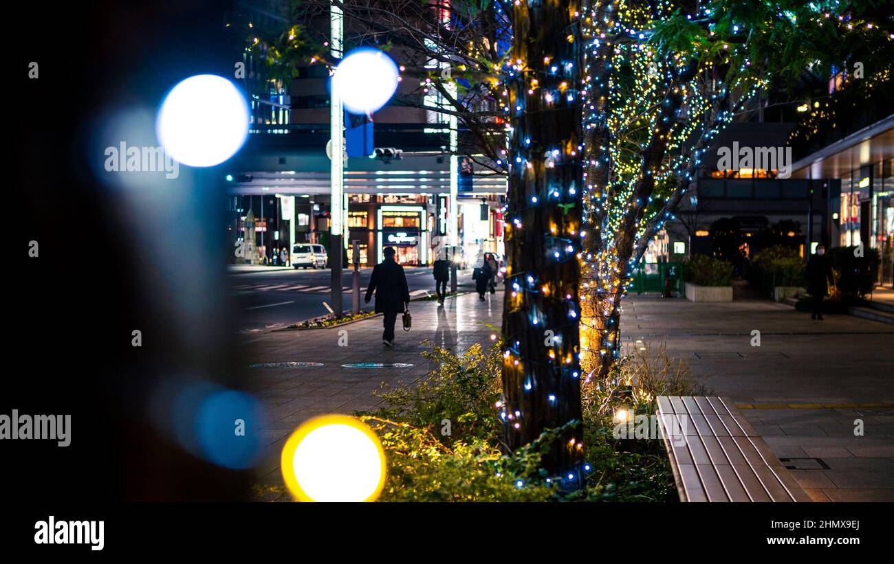 Asian man walking and shopping on the modern street center of Tokyo ...