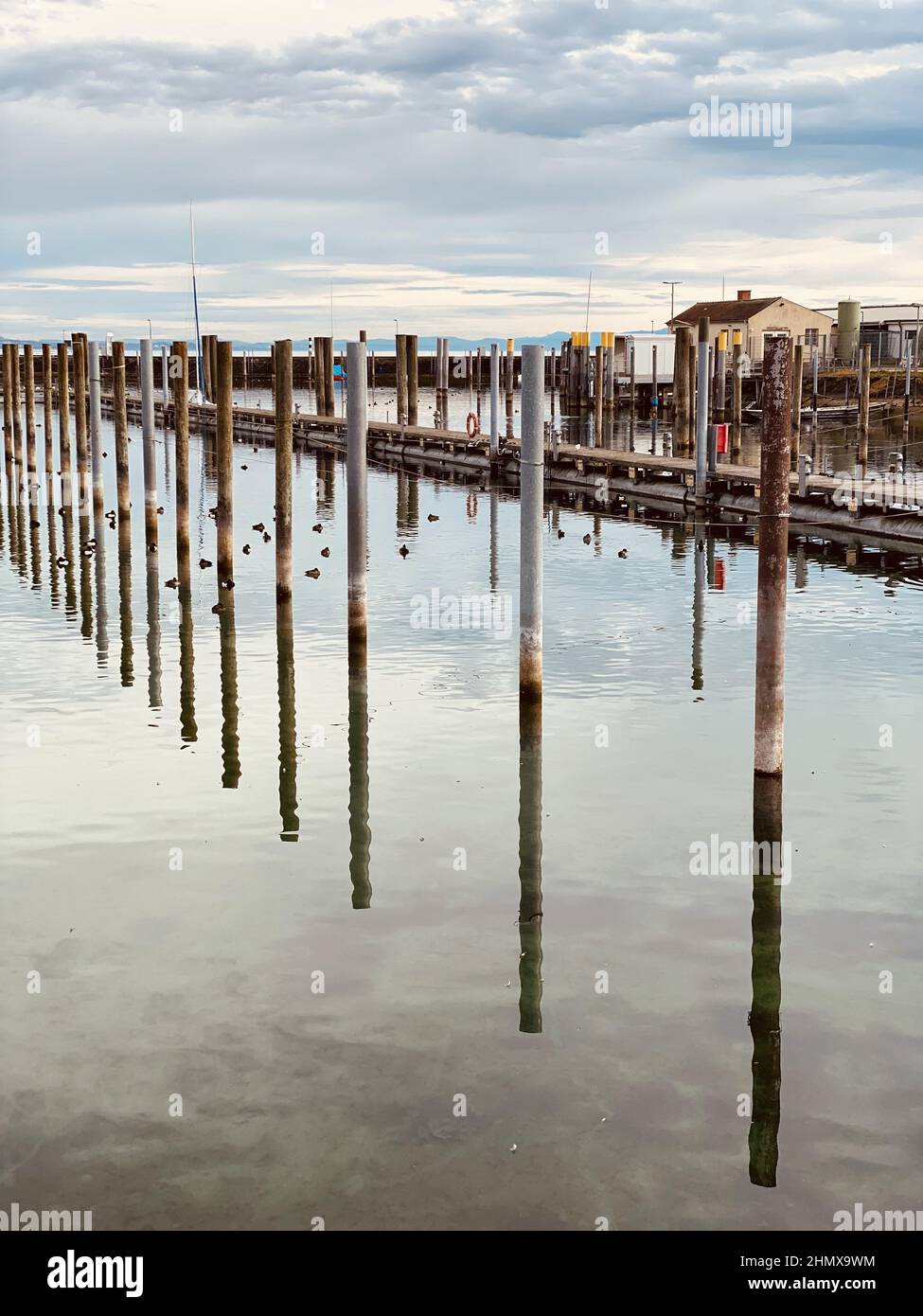 Closeup of steel pipes in the water with cloudy sky background Stock ...