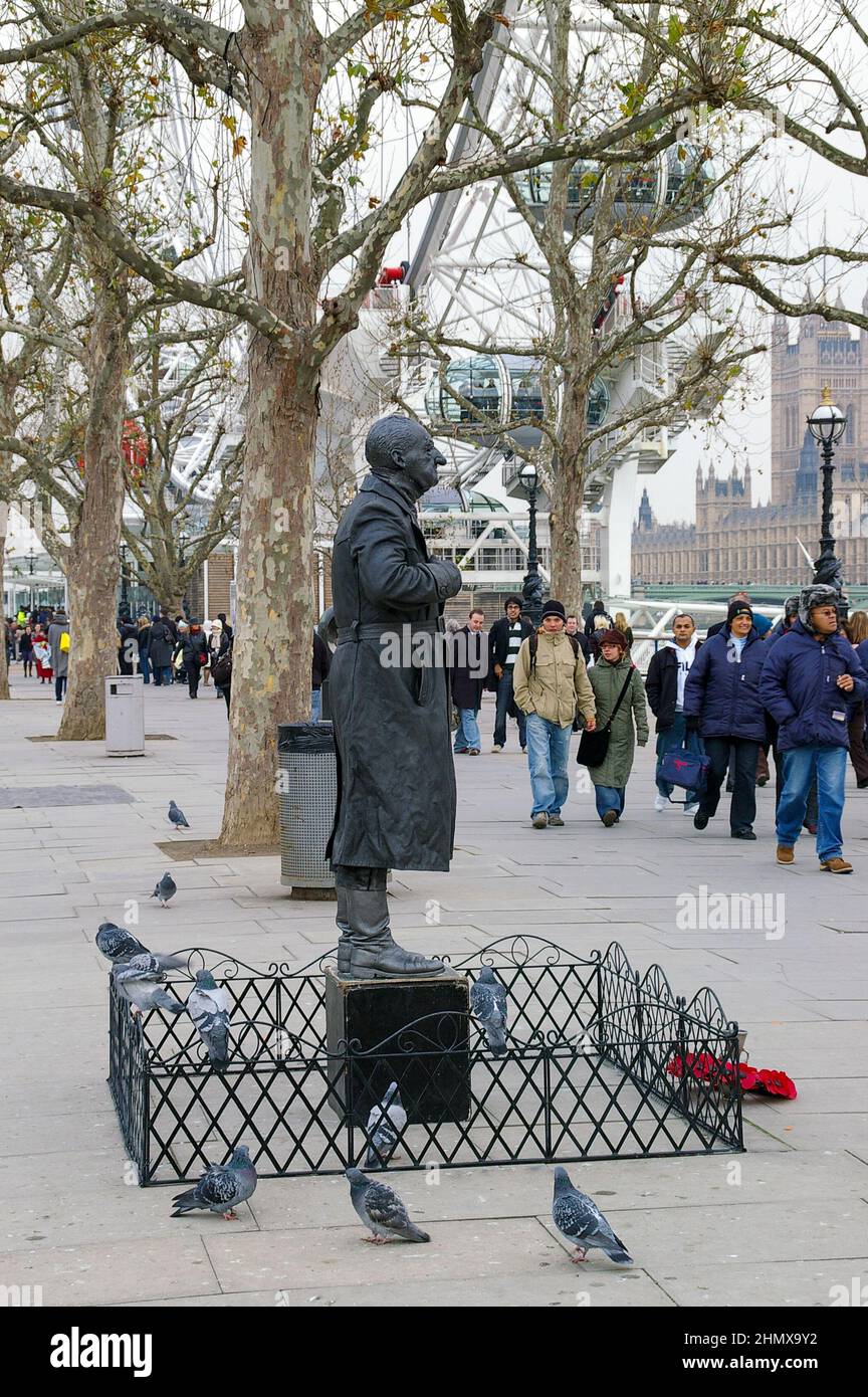 Street entertainer posing as a statue, possibly of Charles de Gaulle ...
