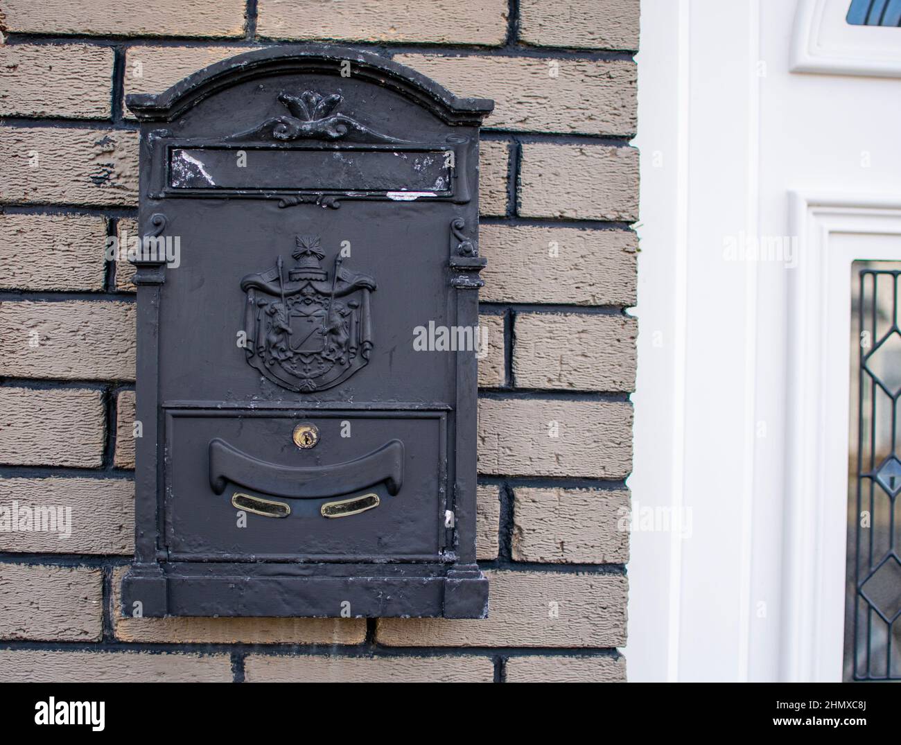 Mailboxes mounted at entry gates, mailboxes embedded in a stone wall ...