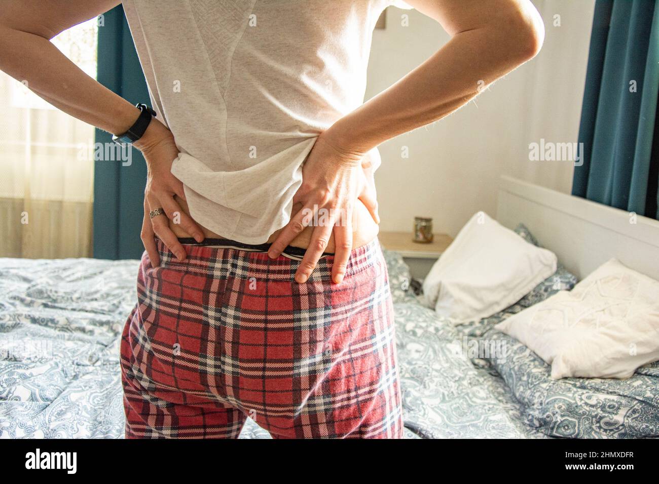Spasm on the girl's back. Area of the injury, the image on a clean ...