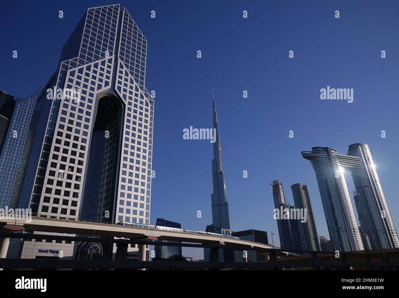 The Dusit Thani Dubai hotel (left), the Burj Khalifa skyscraper and The ...