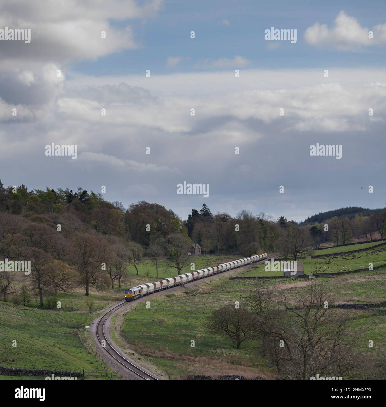 A GB Railfreight class 66 locomotive 66738 hauling a train of empty ...