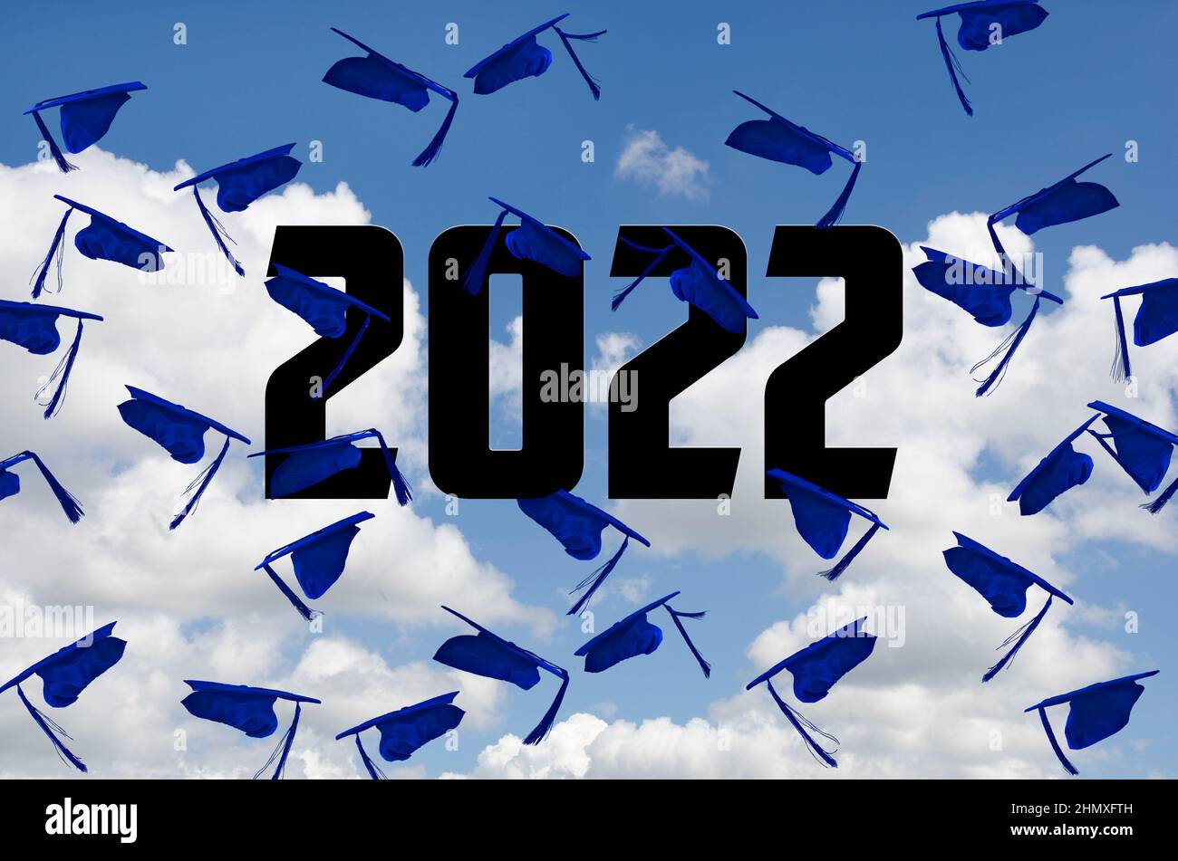 Blue graduation caps airborne in summer sky with 2022 text Stock Photo ...