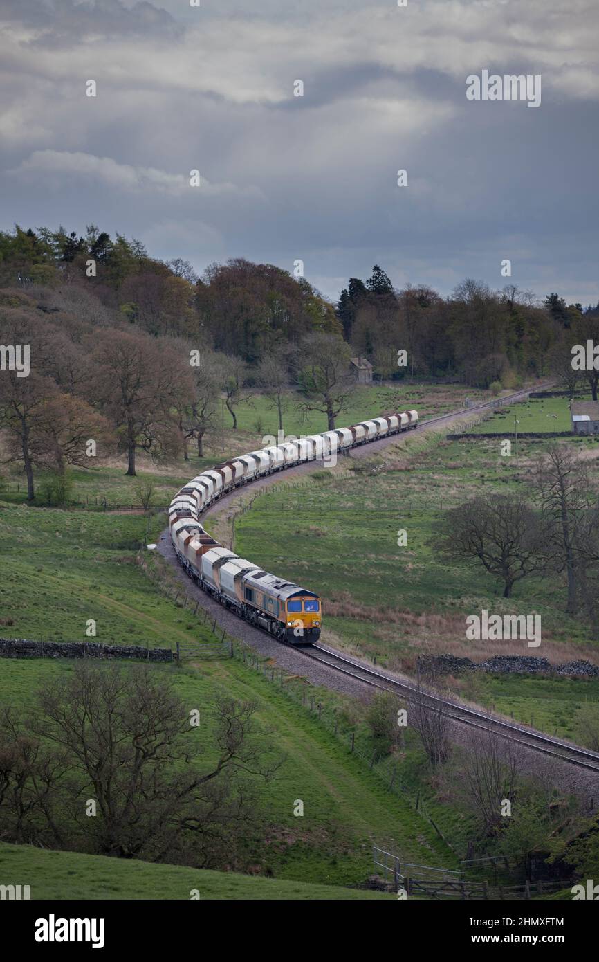 A GB Railfreight class 66 locomotive 66738 hauling a train of empty ...