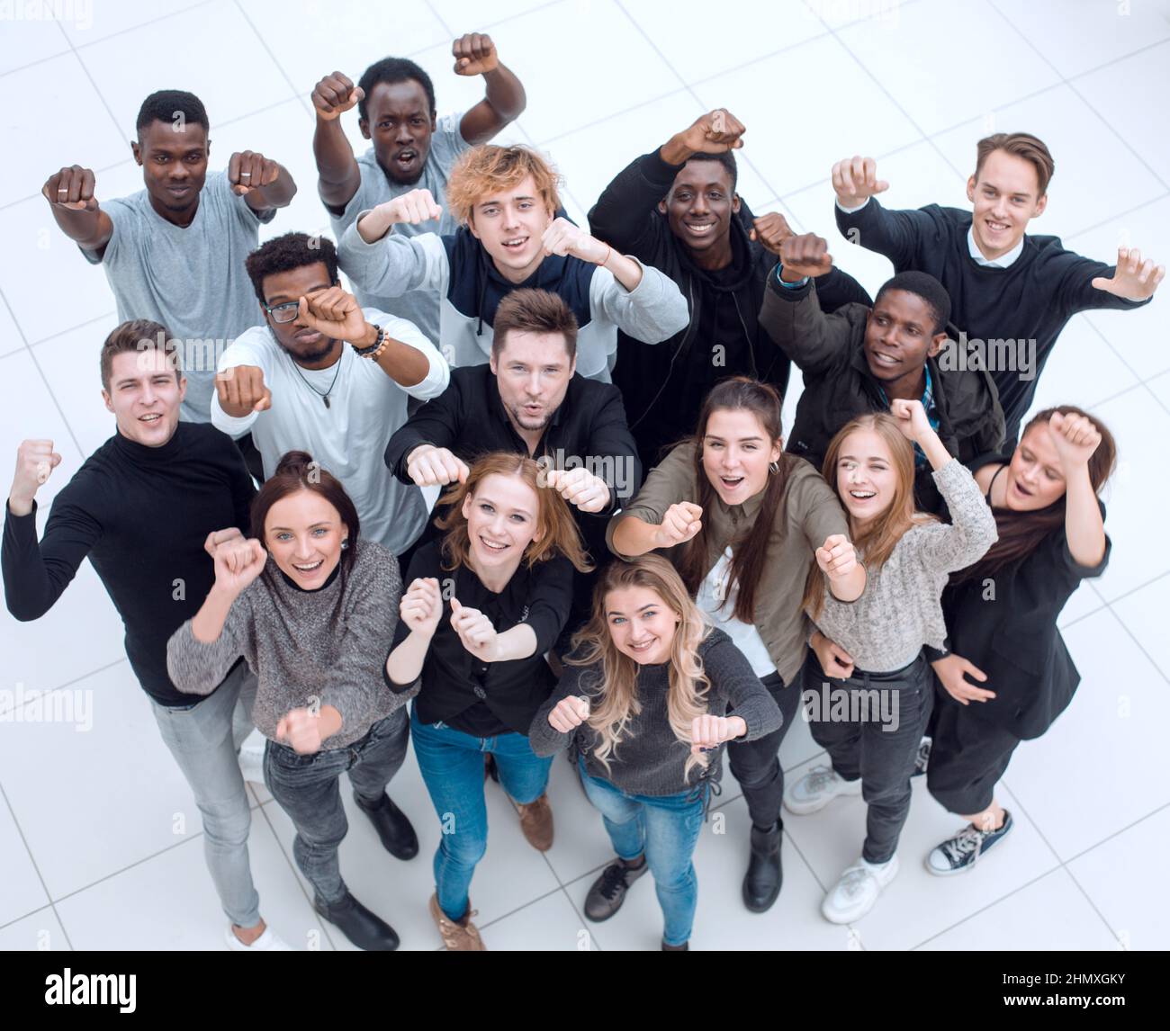 top view. team of diverse young people looking at the camera . isolated ...