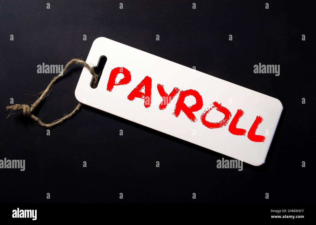 White paper with text PAYROLL isolated on blue background Stock Photo ...