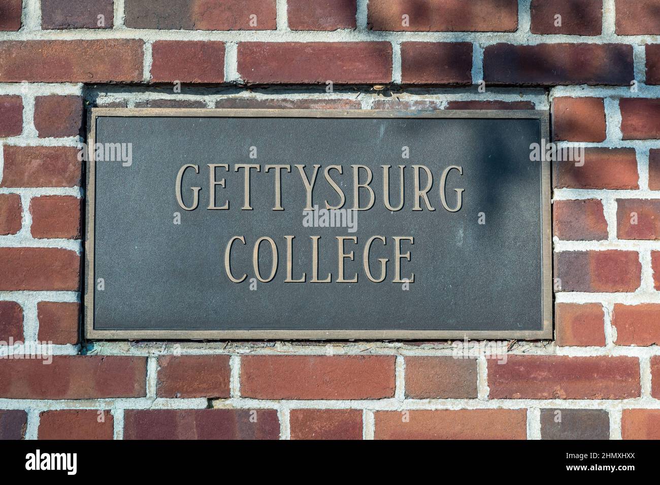 The Gettysburg College sign imbedded in a brick wall on campus in ...