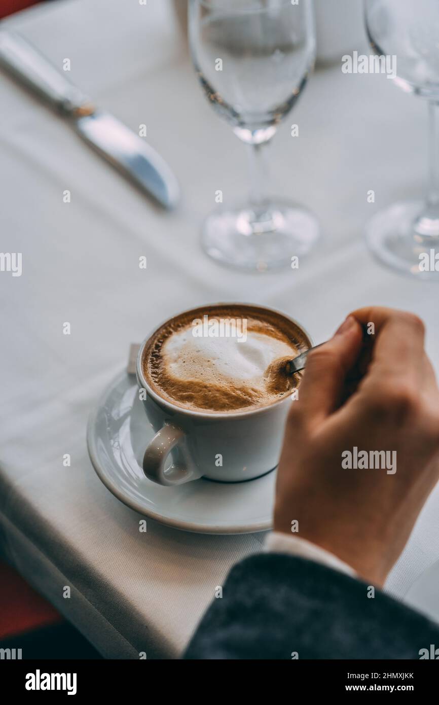 Hand stirring coffee hi-res stock photography and images - Alamy