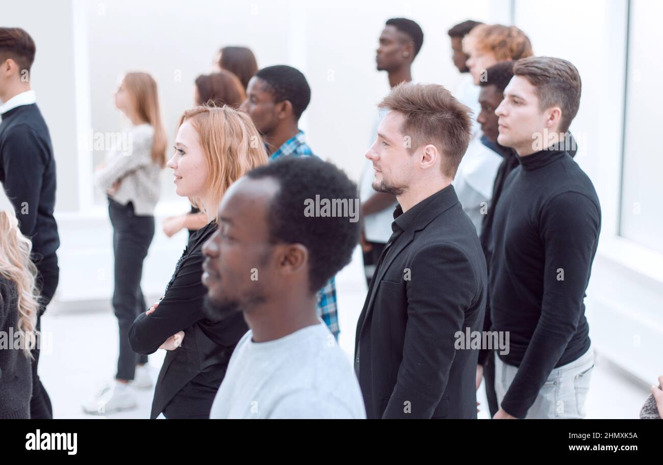 side view . group of diverse young people looking forward Stock Photo ...