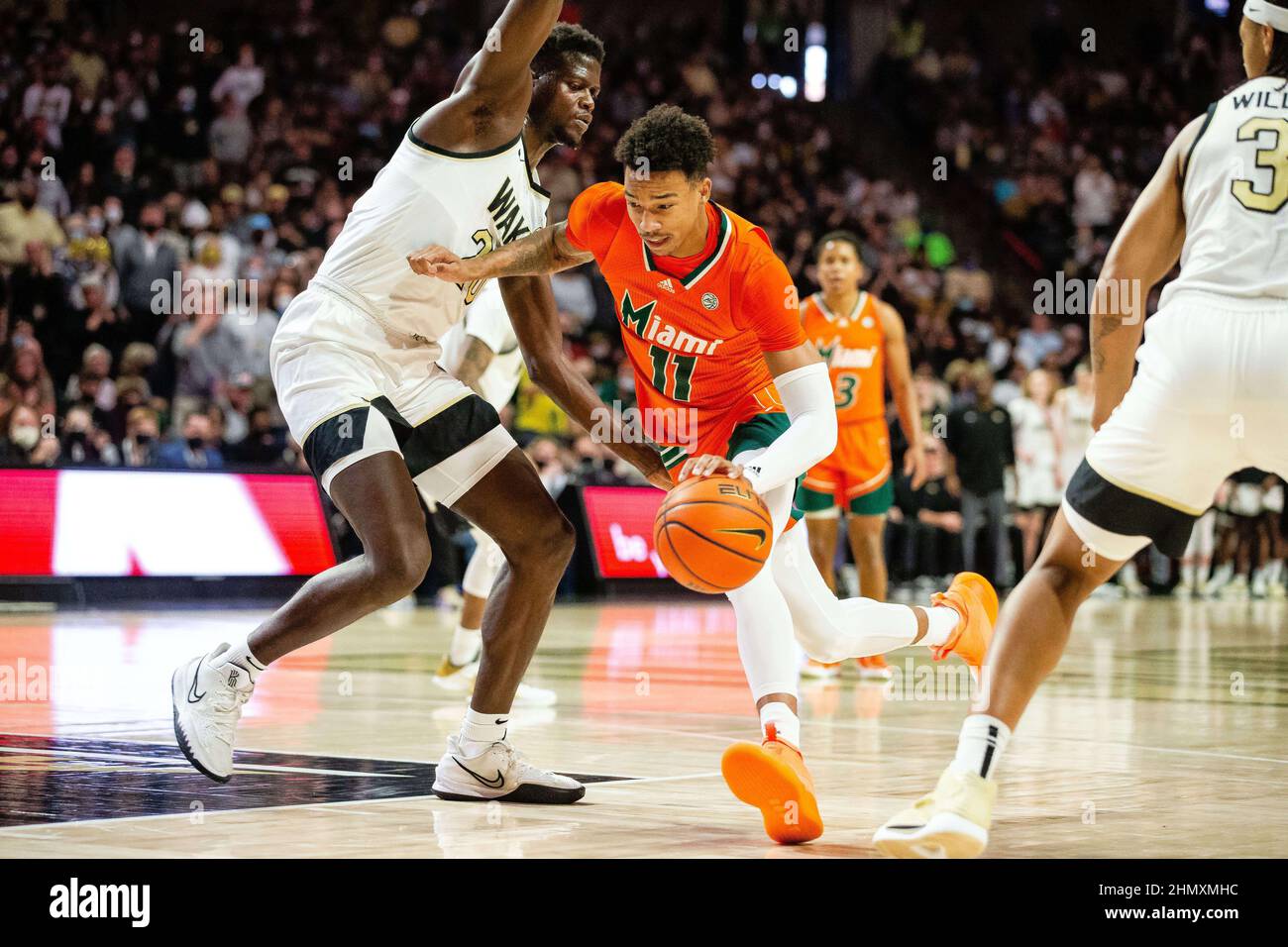 Winston-Salem, NC, USA. 12th Feb, 2022. Wake Forest Demon Deacons forward Khadim Sy (20) guards ...