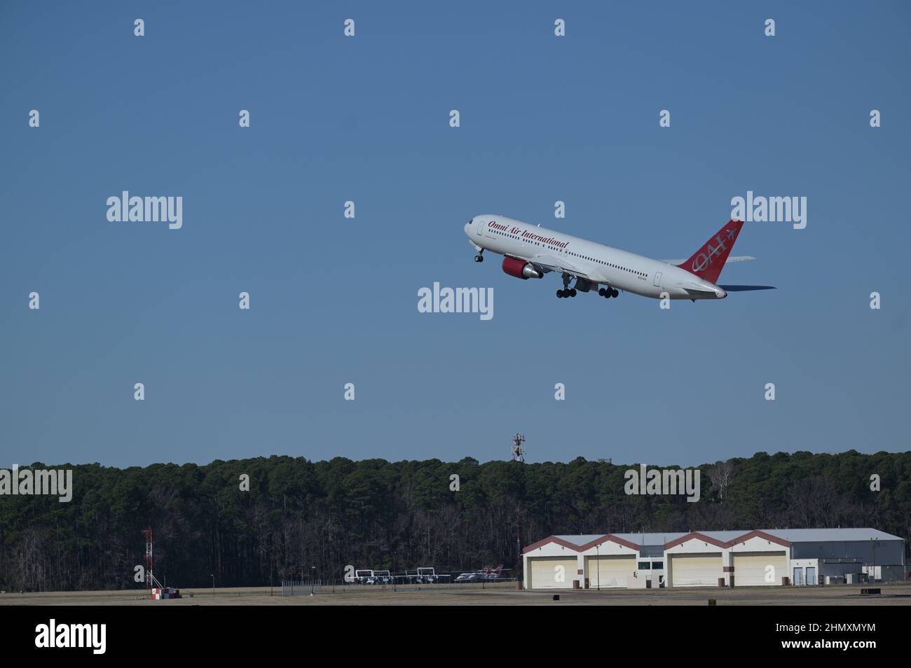 An Omni Air International 767-300ER takes off holding 1st Fighter Wing ...
