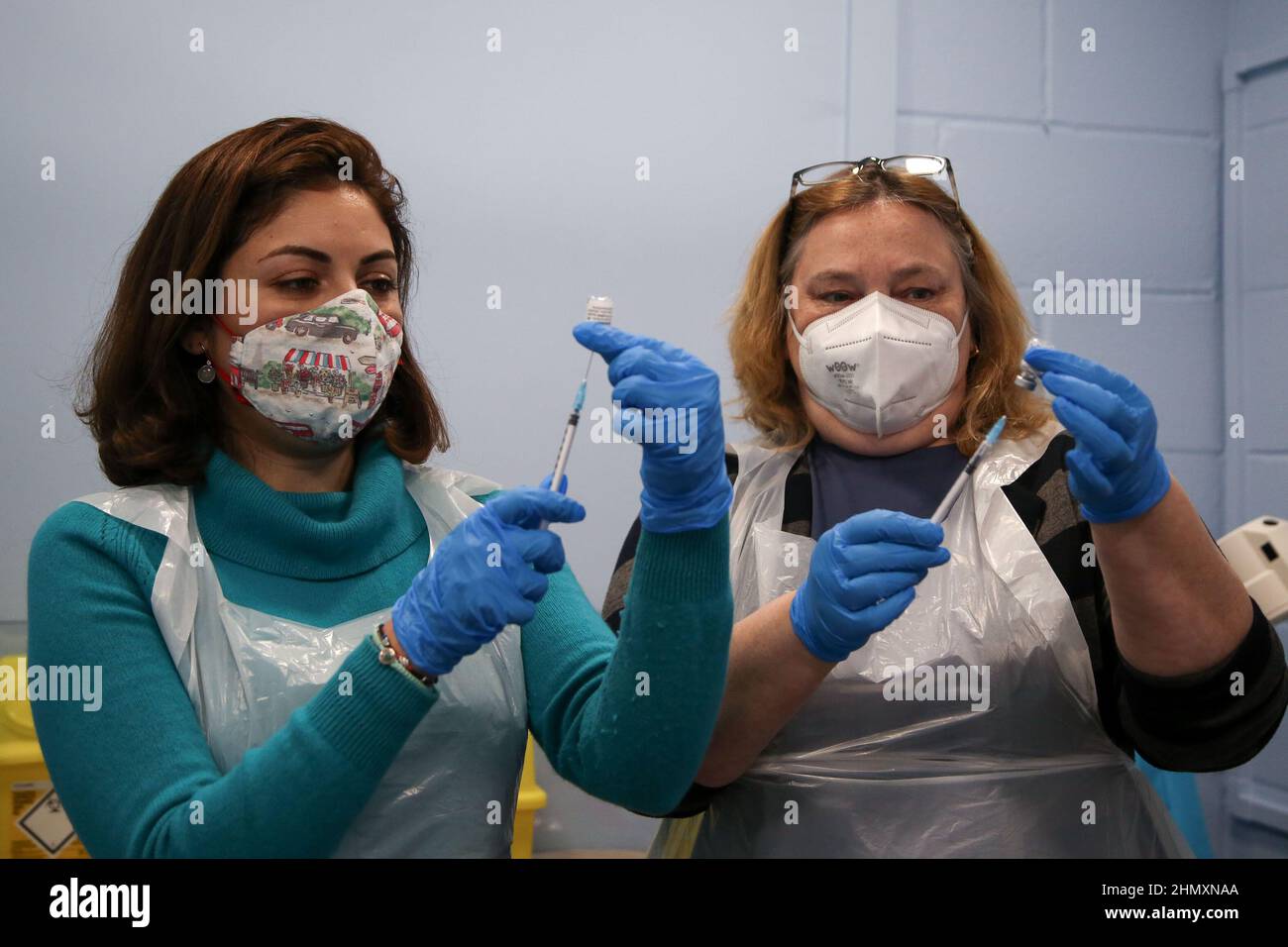 London, UK. 12th Feb, 2022. Vaccinators prepare to administer Pfizer ...
