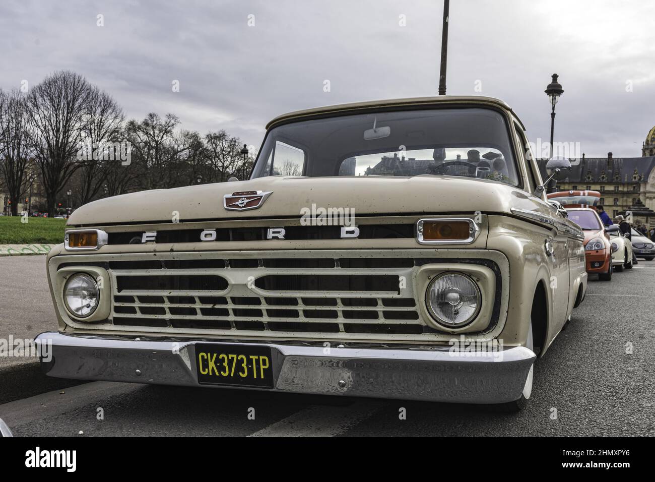 Photo of Ford F-100 van cream color, pick up truck parked in the street ...